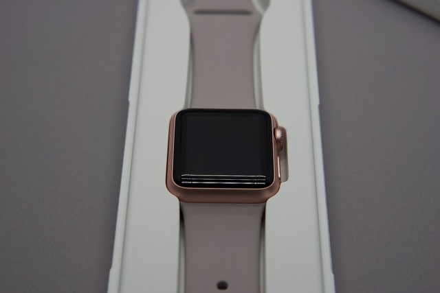 Rose Gold Apple Watch Sport with Sand Band in White Retail Tray — Close-Up Unboxing Presentation